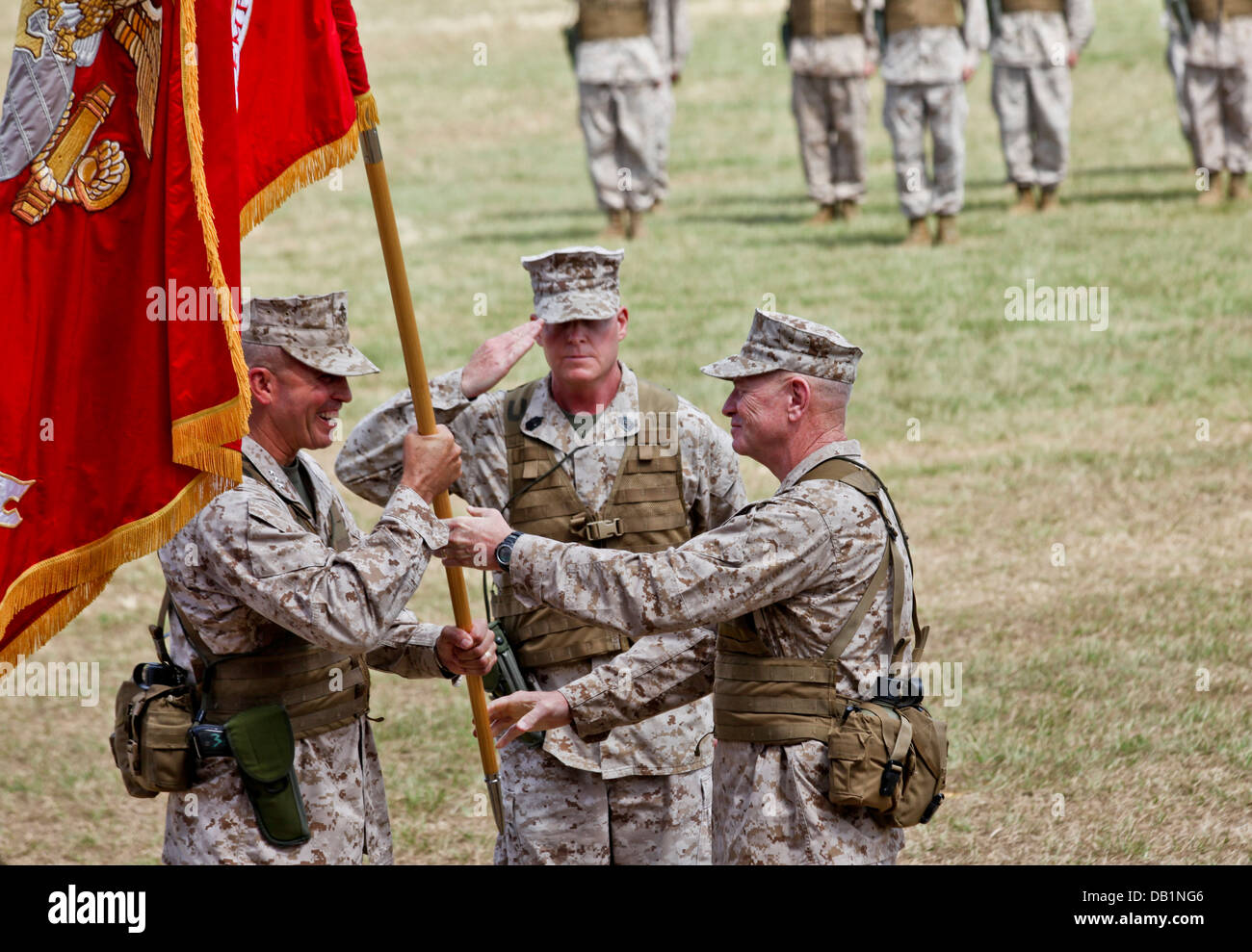 Lt. Gen. Kenneth J. Glueck Jr., right, passes the III Marine ...