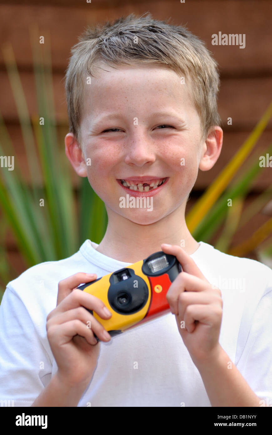 Young Boy Holding a Camera Stock Photo - Alamy