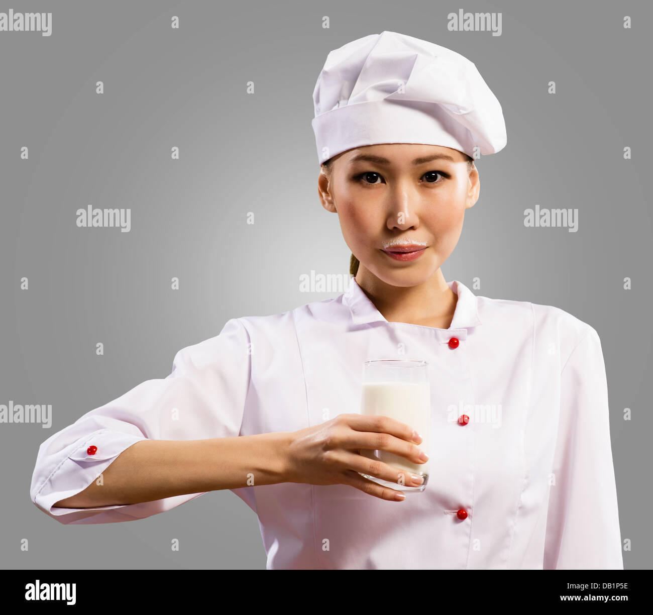 female asian chef holding a glass of milk Stock Photo - Alamy