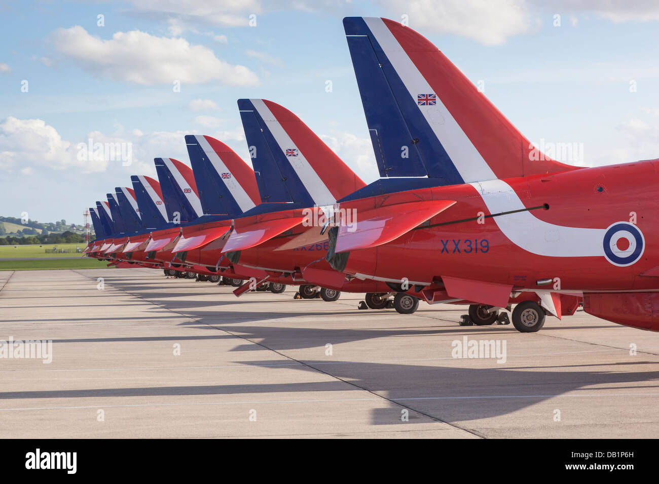 The tails of the RAF Red Arrow Hawks on the runway Stock Photo - Alamy