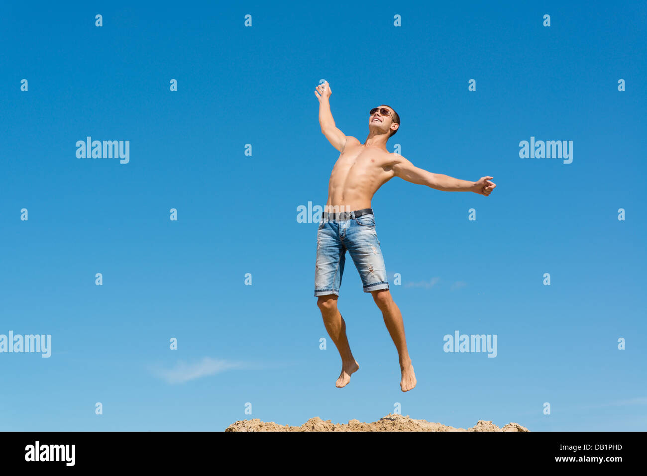 young man jumping Stock Photo - Alamy