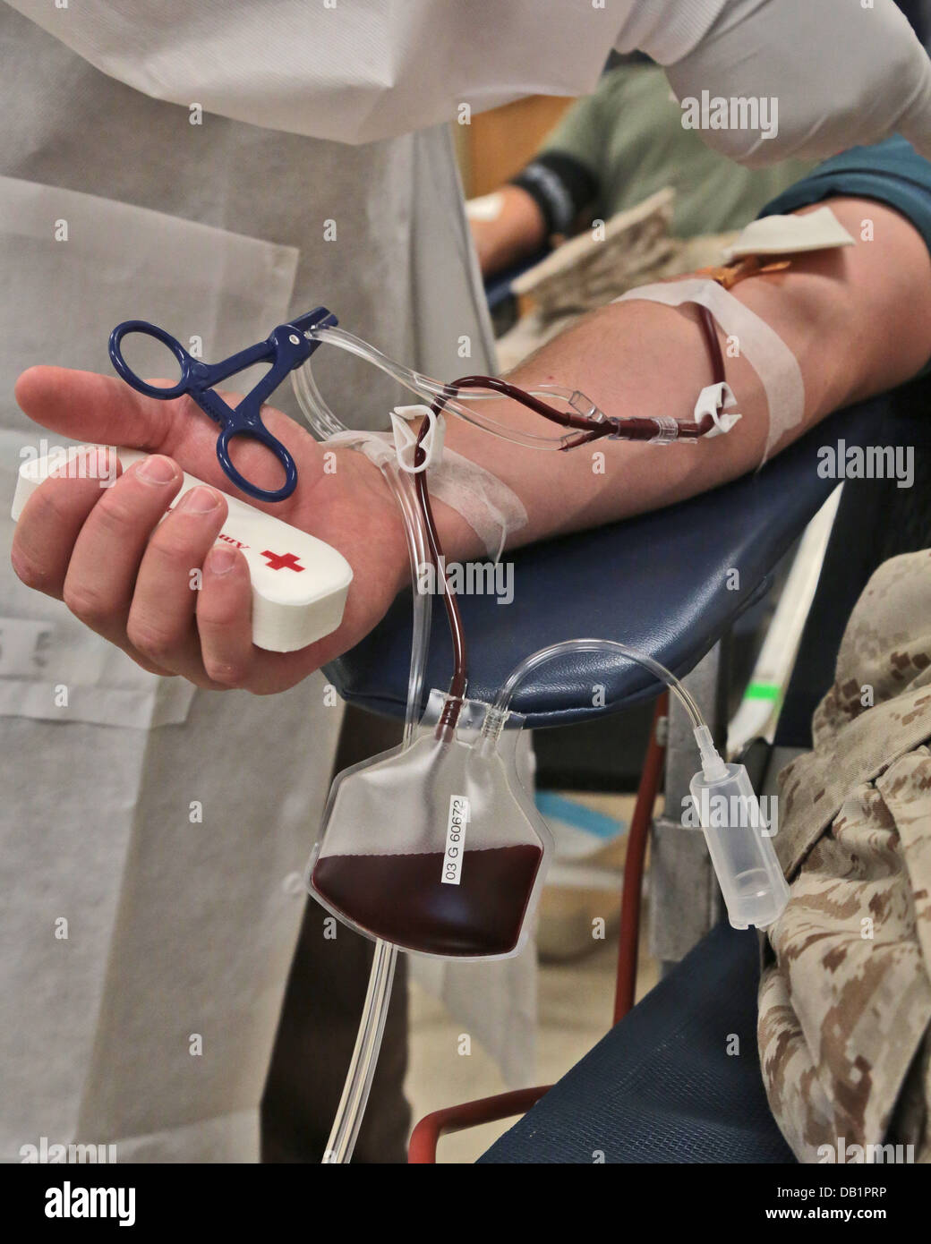 U.S. Marines donate blood at the base chapel aboard Marine Corps Air ...