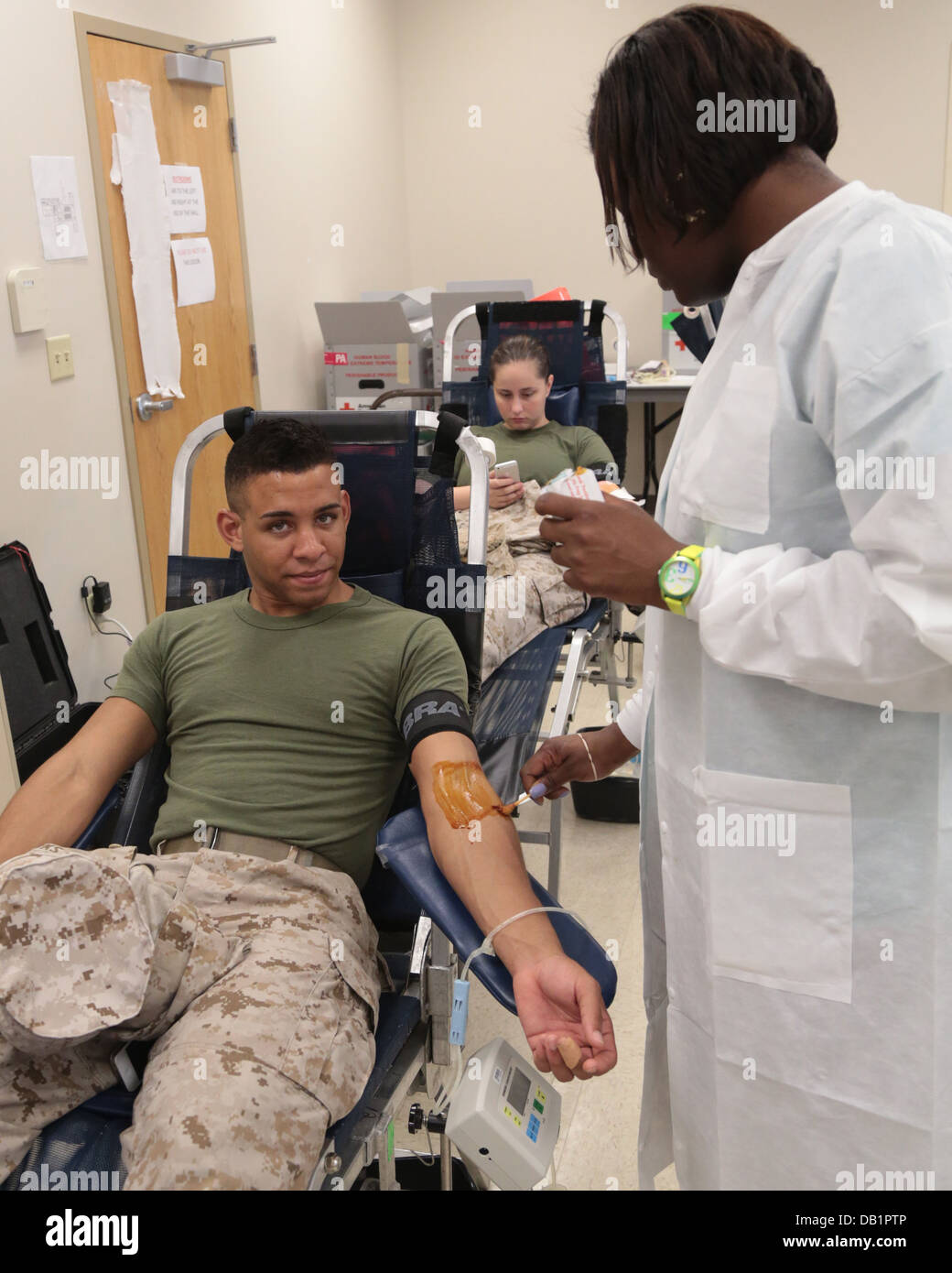 U.S. Marines donate blood at the base chapel aboard Marine Corps Air ...