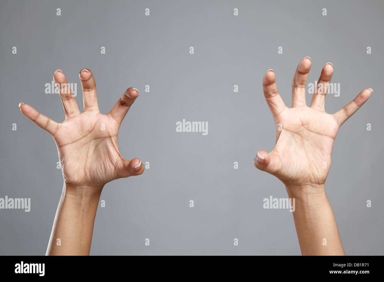 Woman's hands scary gesture Stock Photo - Alamy