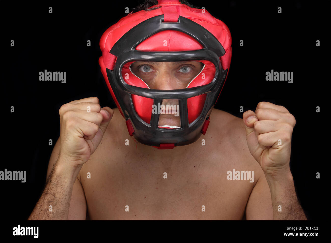 boxer poses with his guard up over black background Stock Photo - Alamy