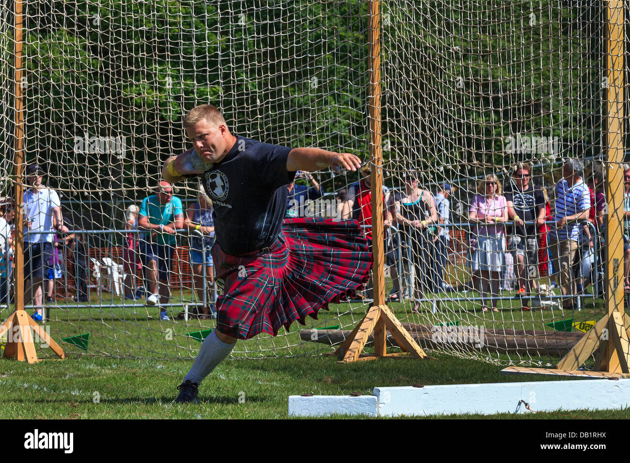 Competitor throwing the 16 pound ball in the traditional Scottish ...