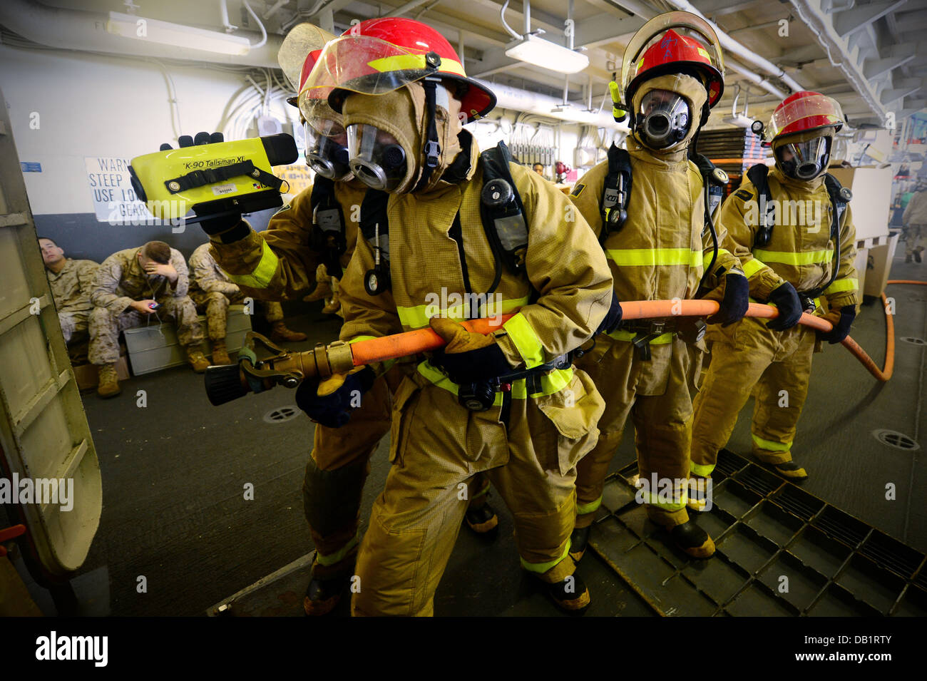 Sailors conduct damage control training during a general quarters drill ...
