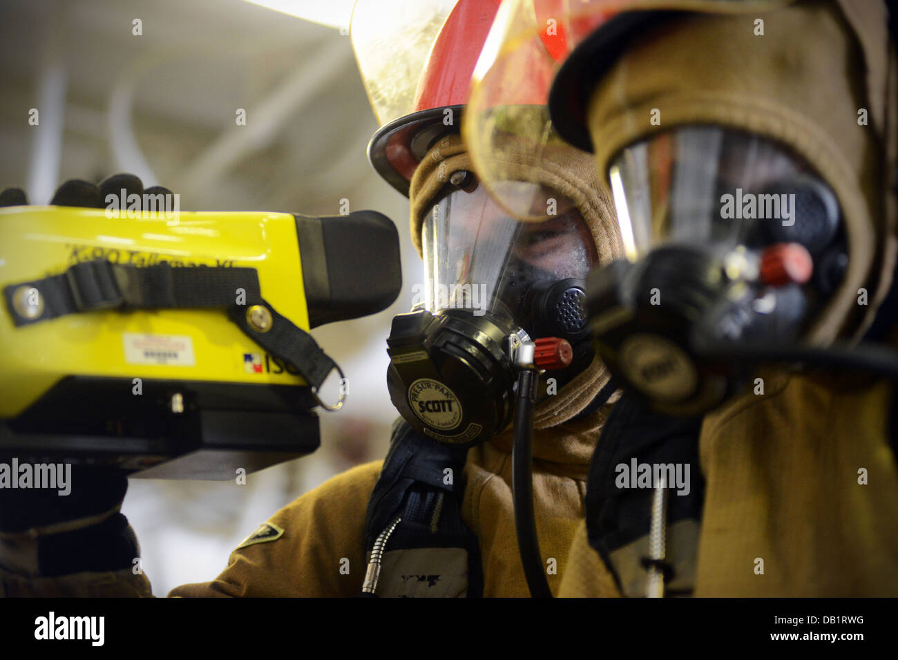 Hull Maintenance Technician 3rd Class Timothy Dunkel uses a thermal ...