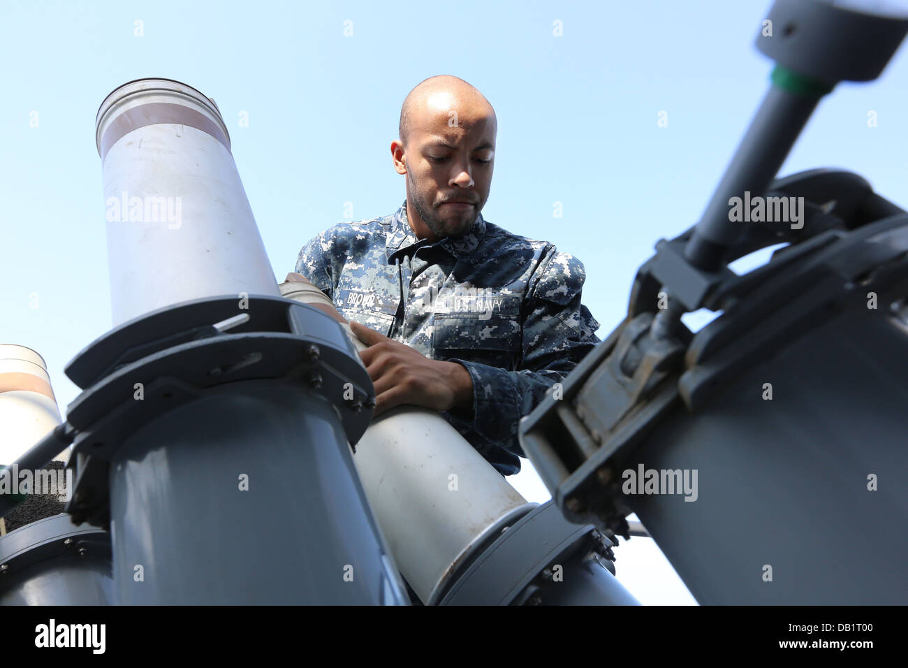 Cryptologic Technician (Collection) 3rd Class Jamal Brown loads a round ...