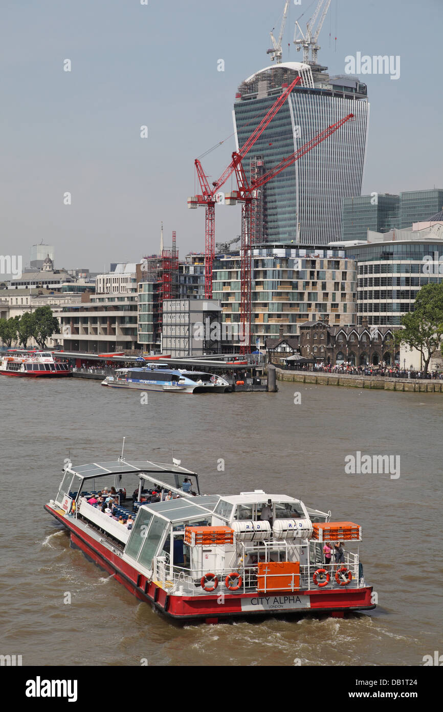 A riverboat on the River Thames in London passes 20 Fenchurch Street ...