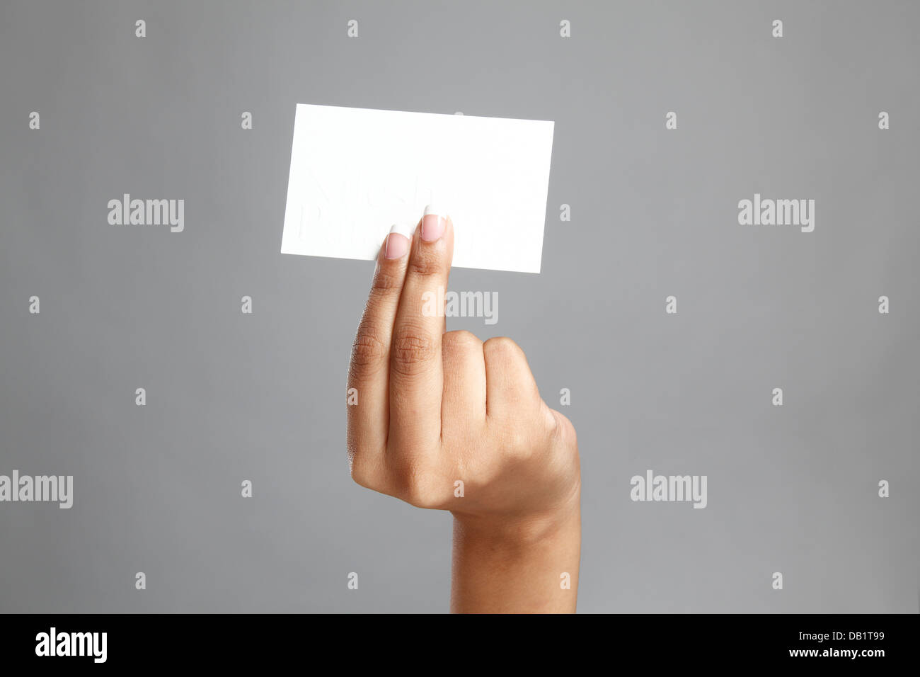 Women's hand showing a business card Stock Photo - Alamy