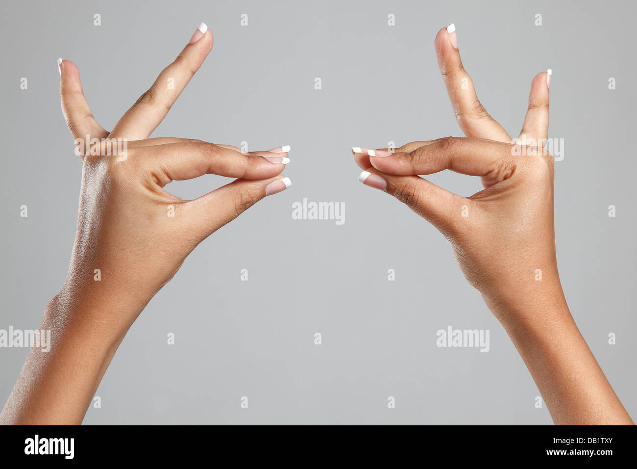 Woman's hands communicating gesture Stock Photo - Alamy