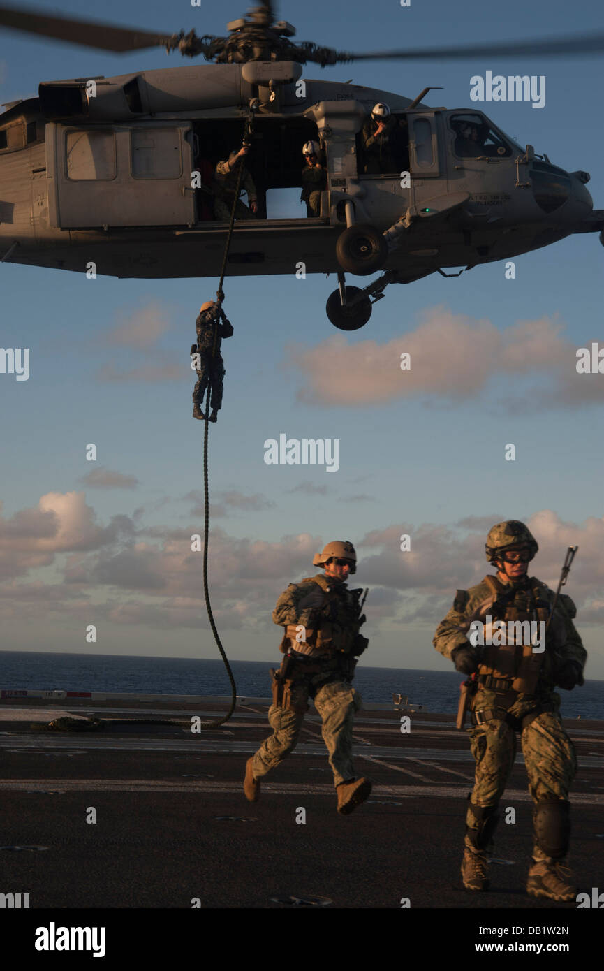 Sailors assigned to Explosive Ordnance Disposal Mobile Unit (EODMU) 5 ...