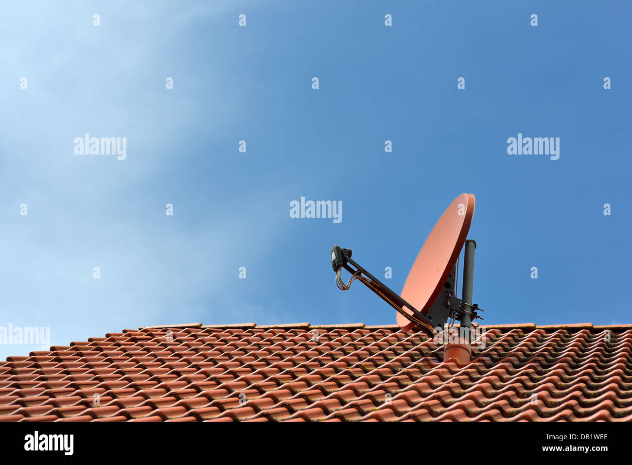 A satellite dish on a house roof Stock Photo - Alamy