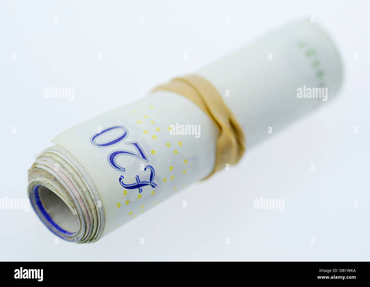 A Roll of Twenty Pound Notes held together with an Elastic Band Stock ...