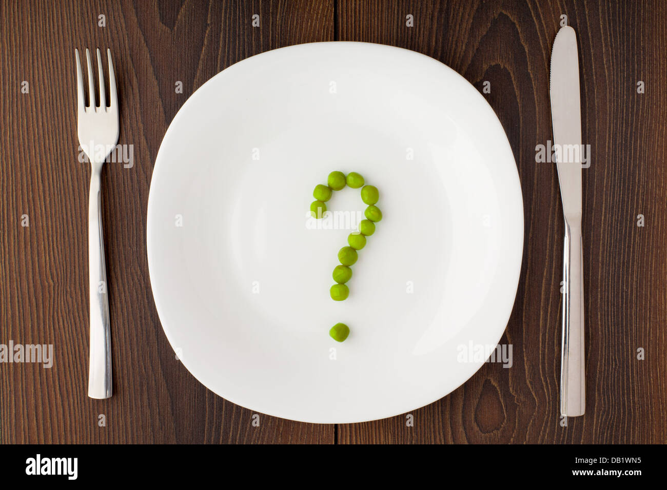 Question mark made of peas on plate Stock Photo - Alamy