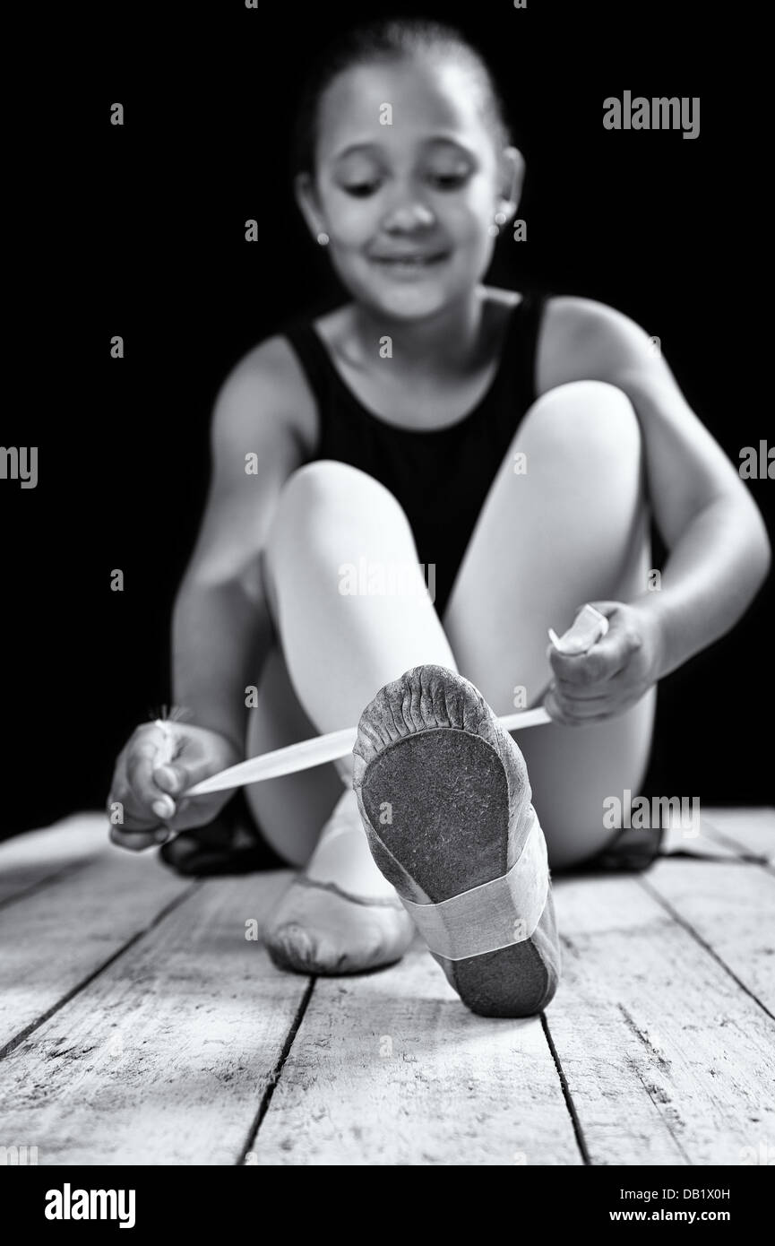 Young ballerina girl in a low key studio. More poses available Stock ...