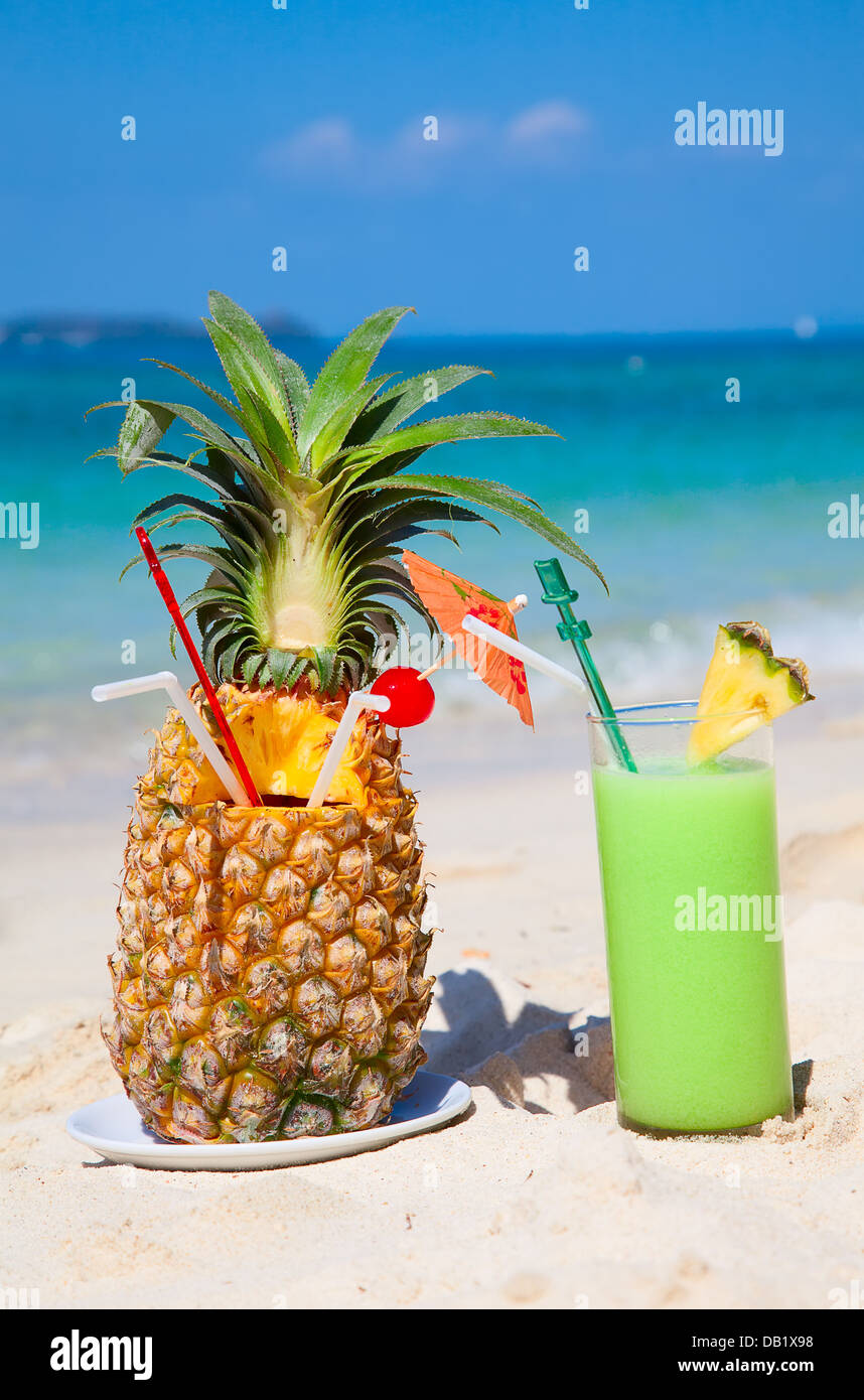 Fresh fruit cocktail on a tropical island beach Stock Photo - Alamy
