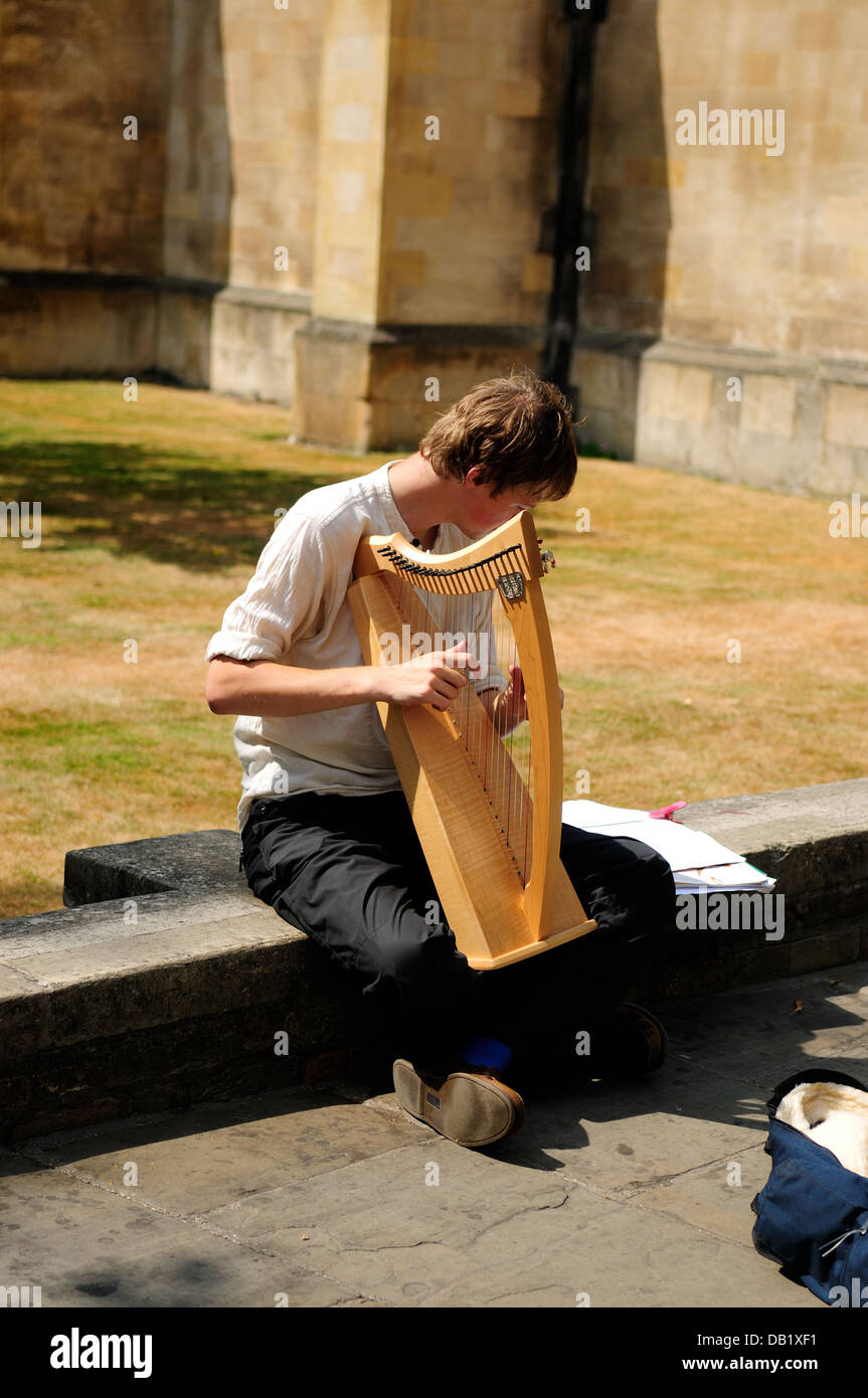 Cambridge Trinity Collage ,Busker Stock Photo - Alamy