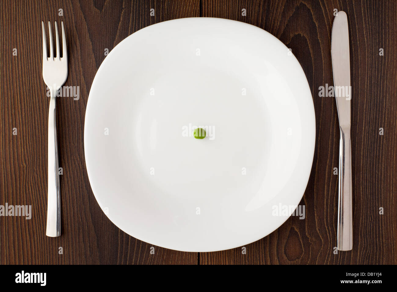 One pea on a white plate Stock Photo, Royalty Free Image: 58435948 - Alamy