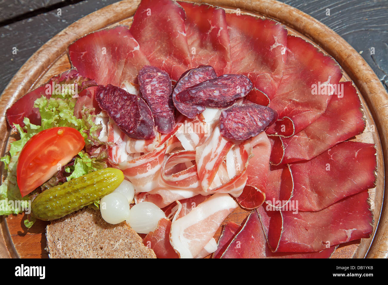 Traditional swiss meat plate on the table Stock Photo - Alamy