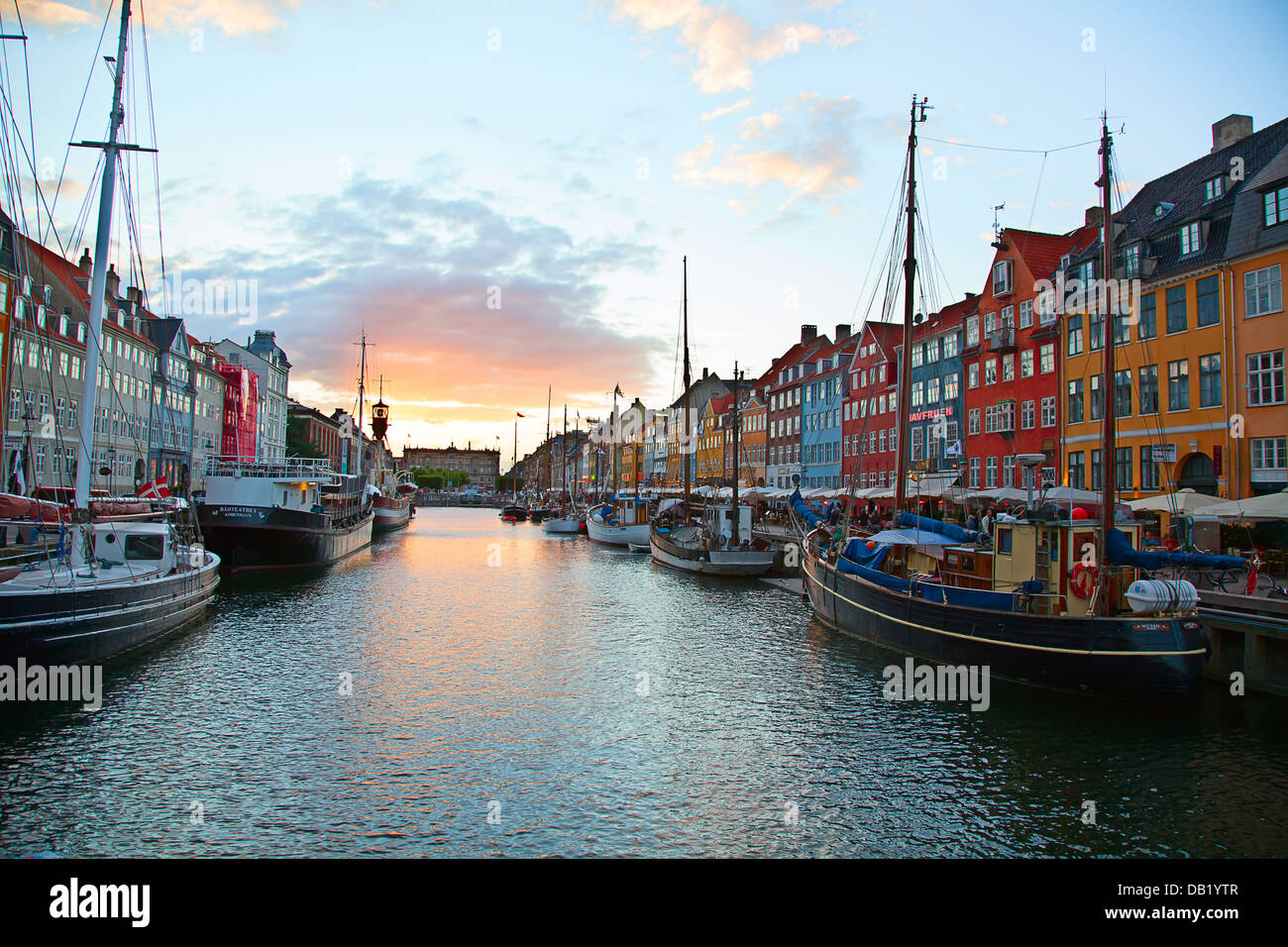 Sunset over Nyhavn district in Copenhagen, Denmark Stock Photo - Alamy