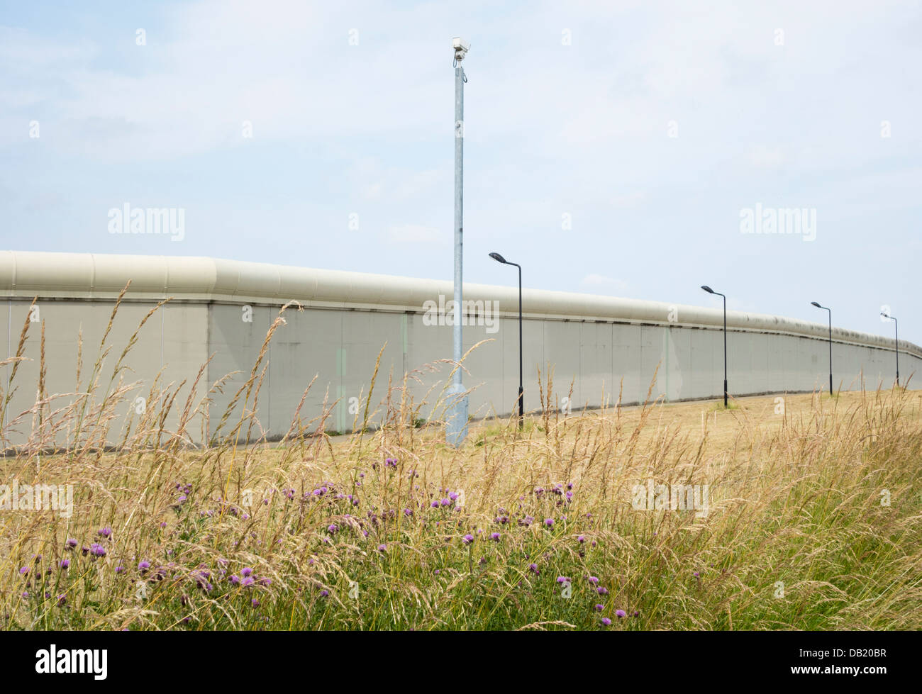 Prison wall with CCTV camera. Holme House prison, Stockton on Tees ...