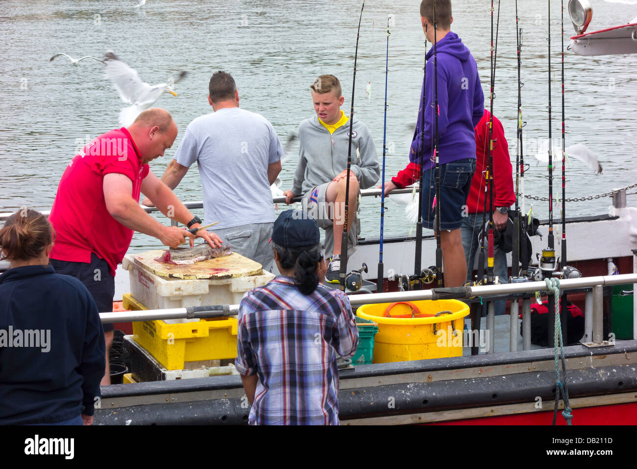 Cleaning a fishing boat hi-res stock photography and images - Alamy