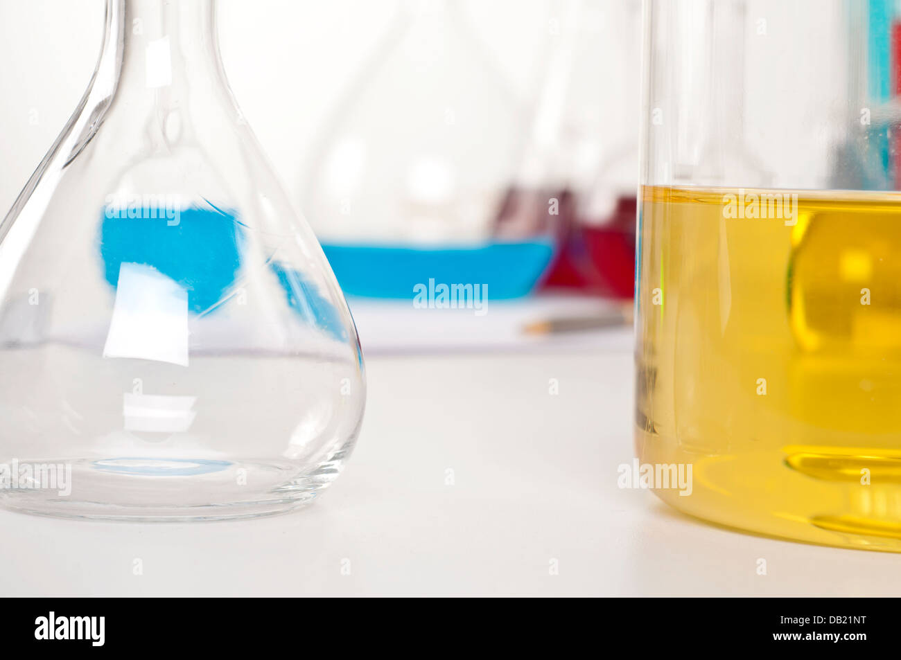 laboratory items, flask with yellow liquid Stock Photo - Alamy