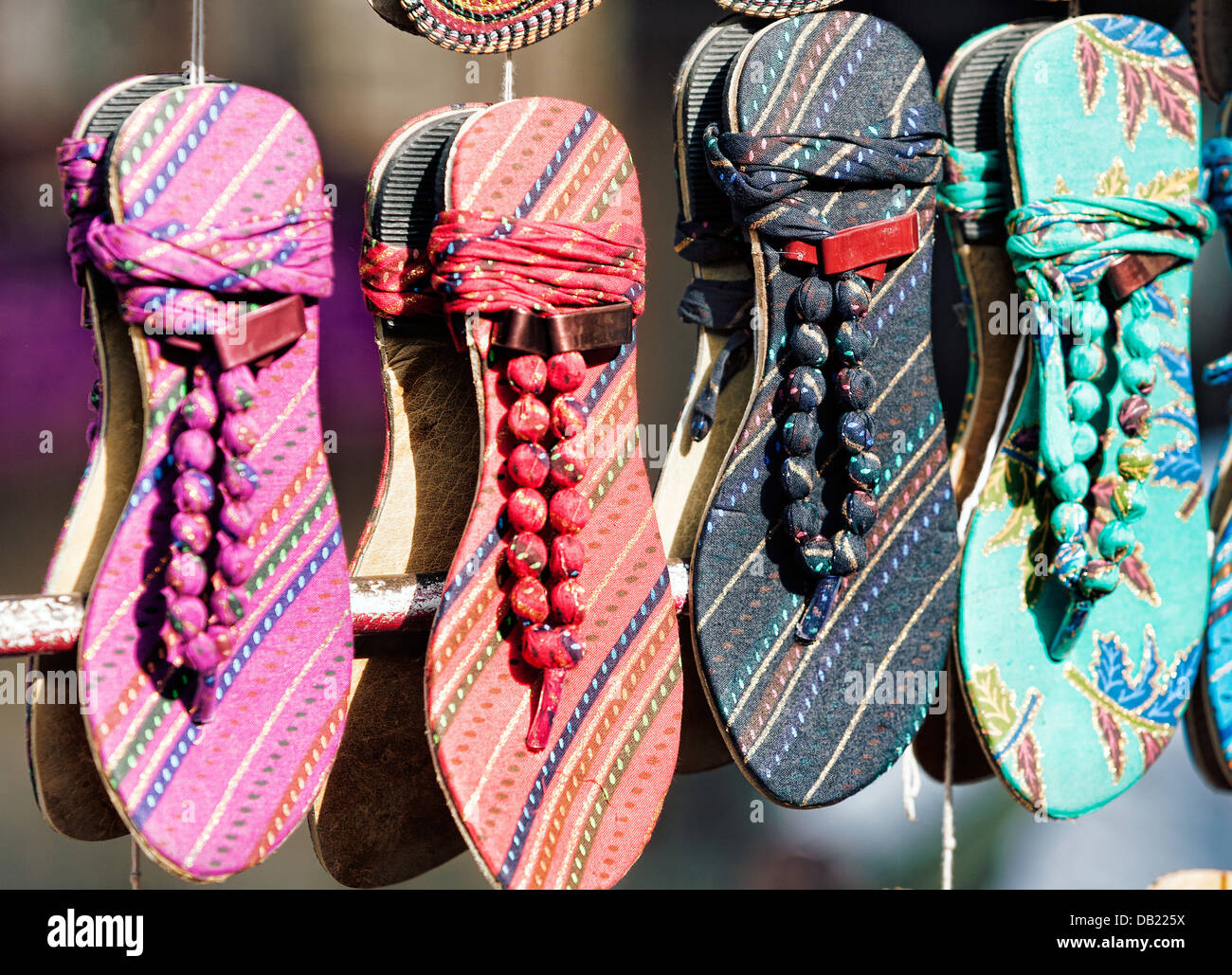 Traditional women's shoes in the local market in India Stock Photo - Alamy