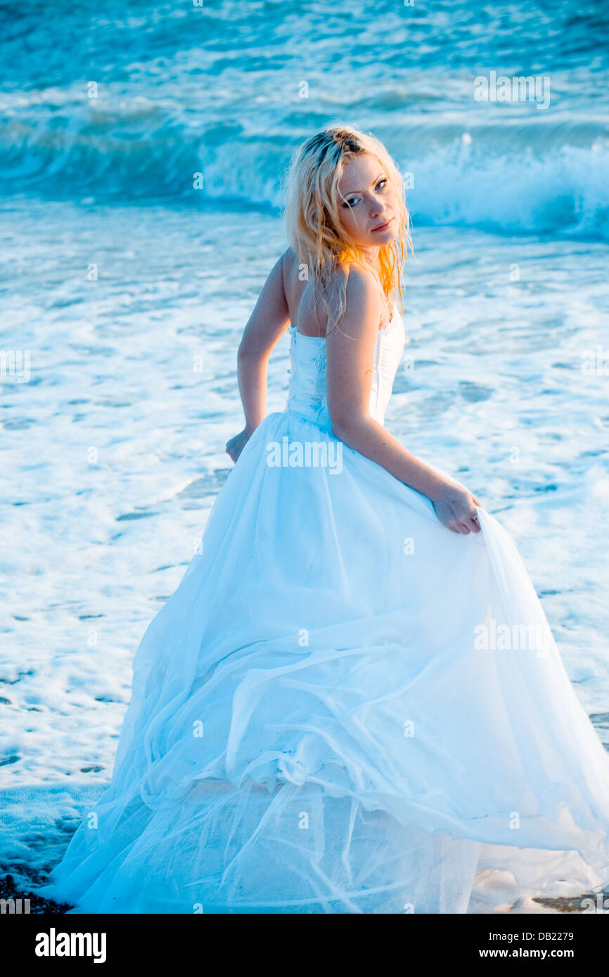 Bride in sea water Stock Photo - Alamy