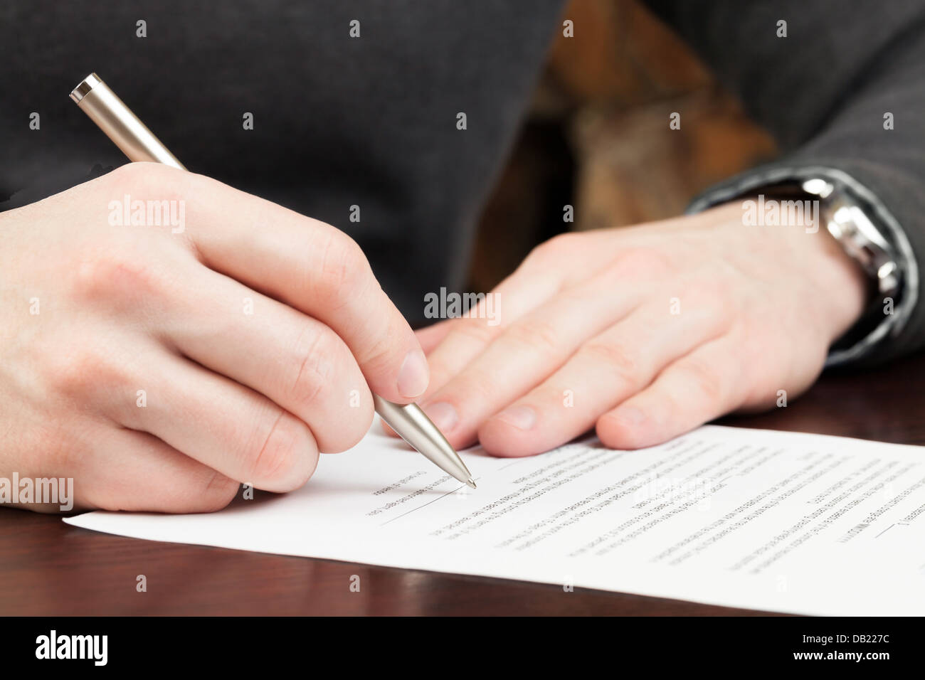 Business man signing documents Stock Photo - Alamy