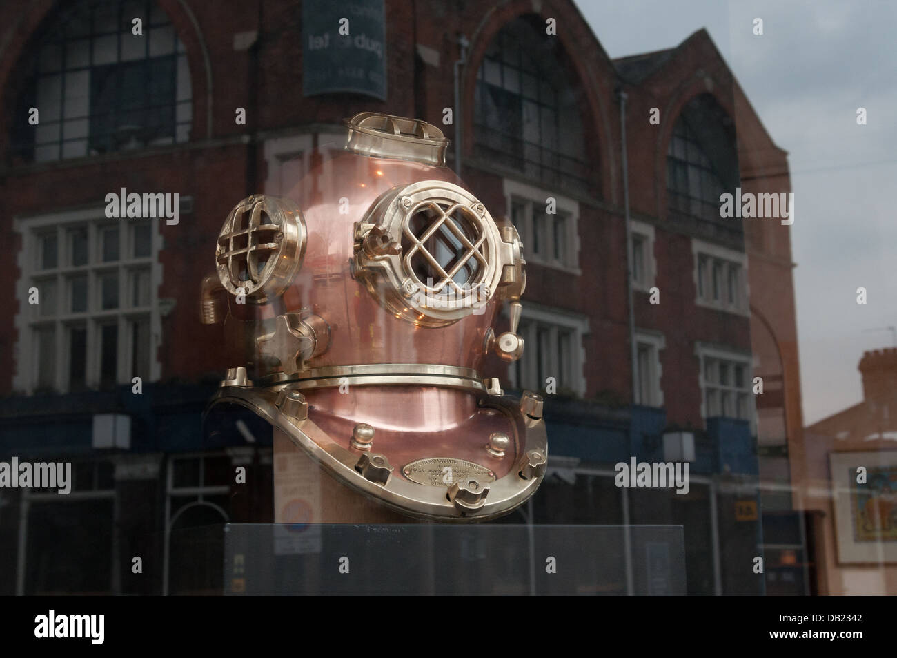 An antique diving helmet seen in a shop window in Highgate, London ...