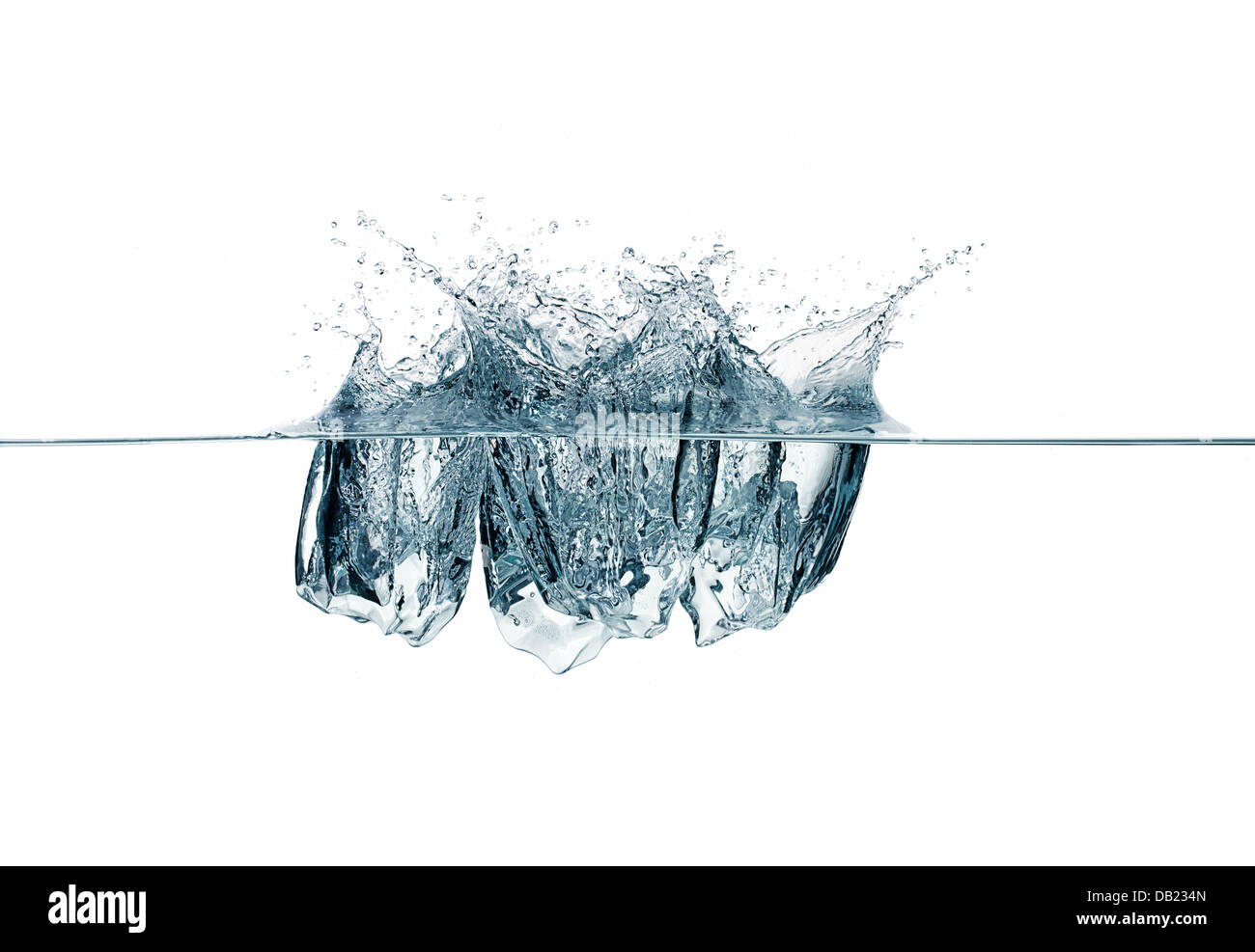 Three Ice Cubes Dropping. Isolated Stock Photo - Alamy