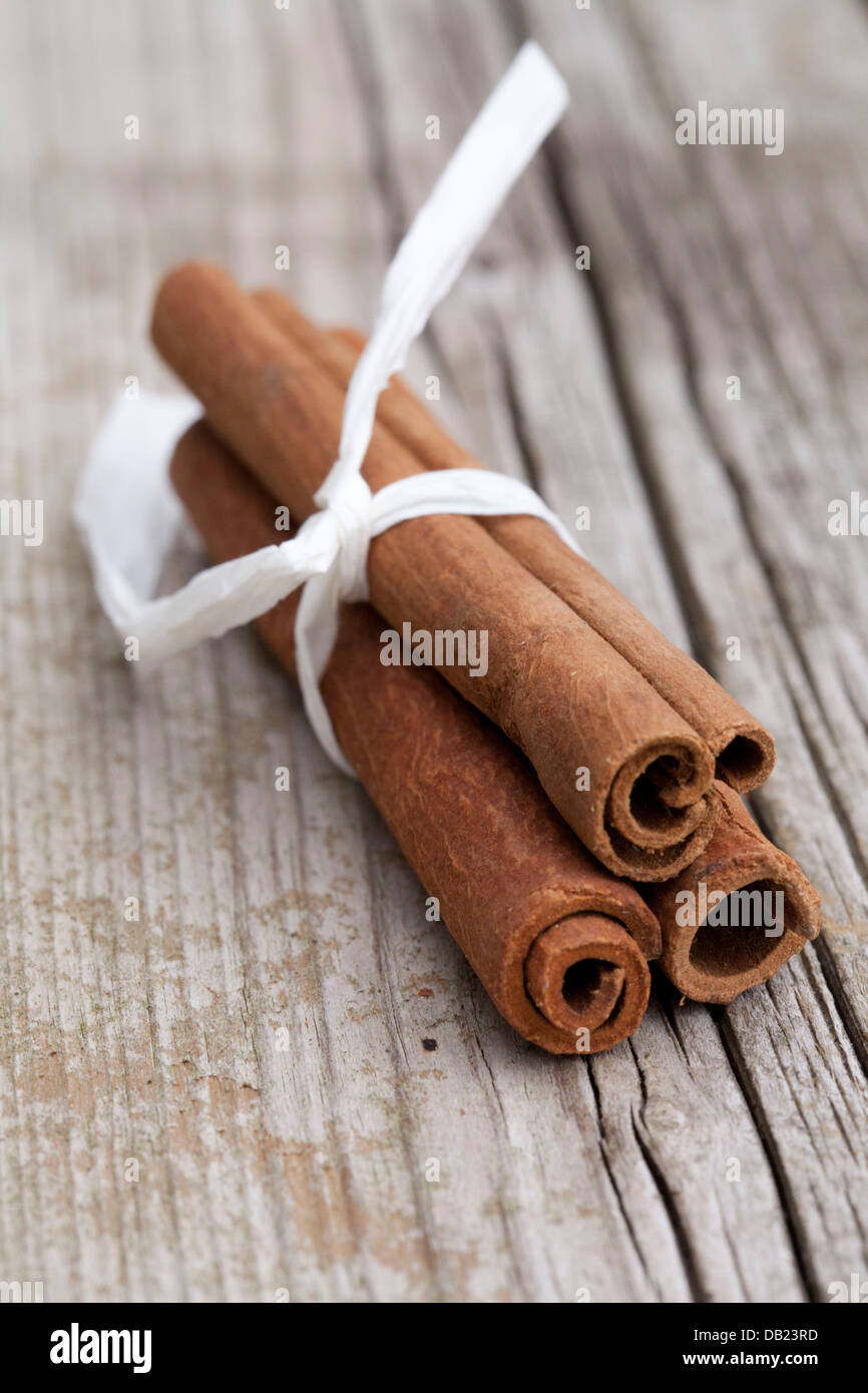 Cinnamon spice Sticks on wood Stock Photo - Alamy