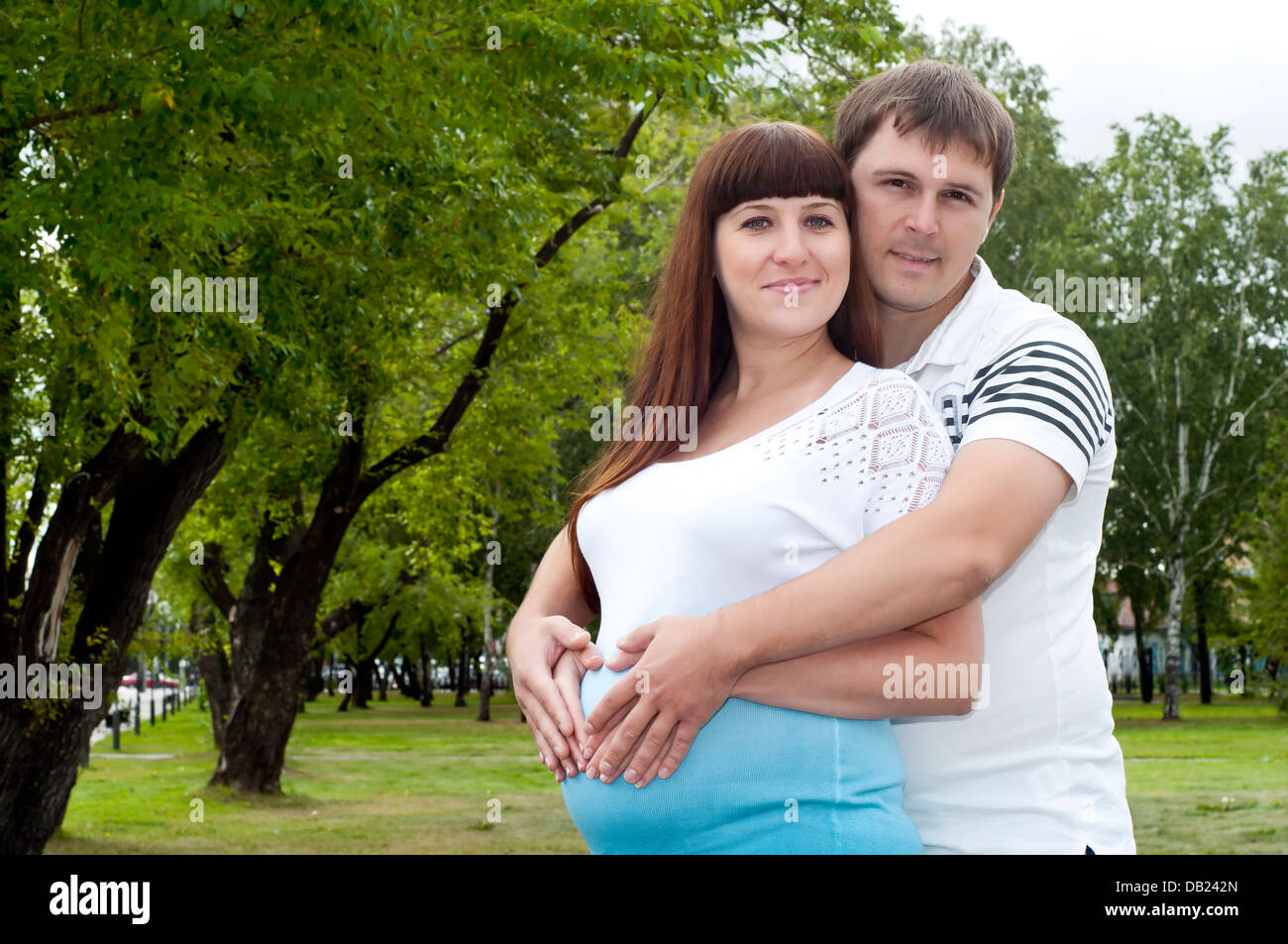 couple lays together, hugging, pregnant woman Stock Photo - Alamy