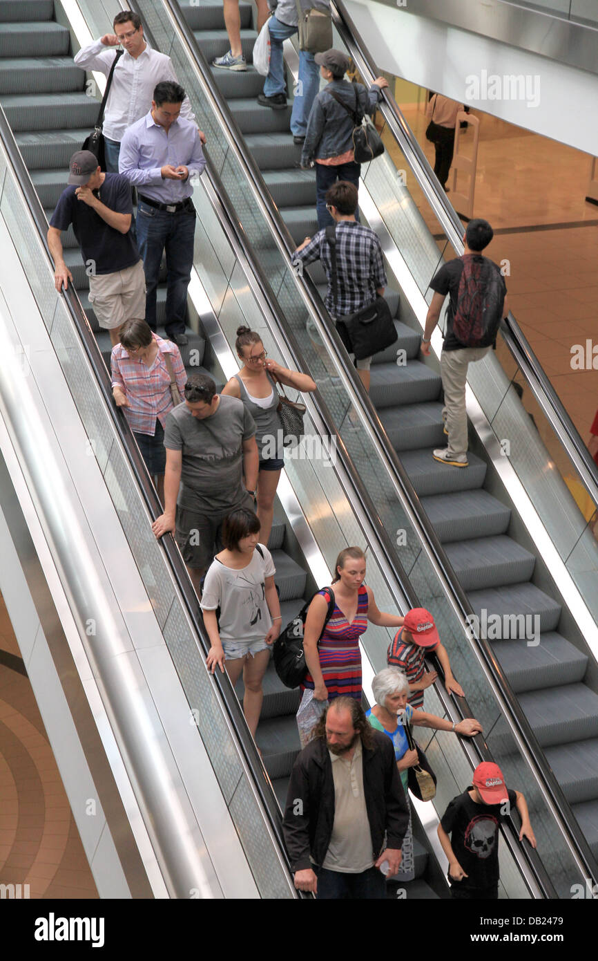 Escalator riding hi-res stock photography and images - Alamy