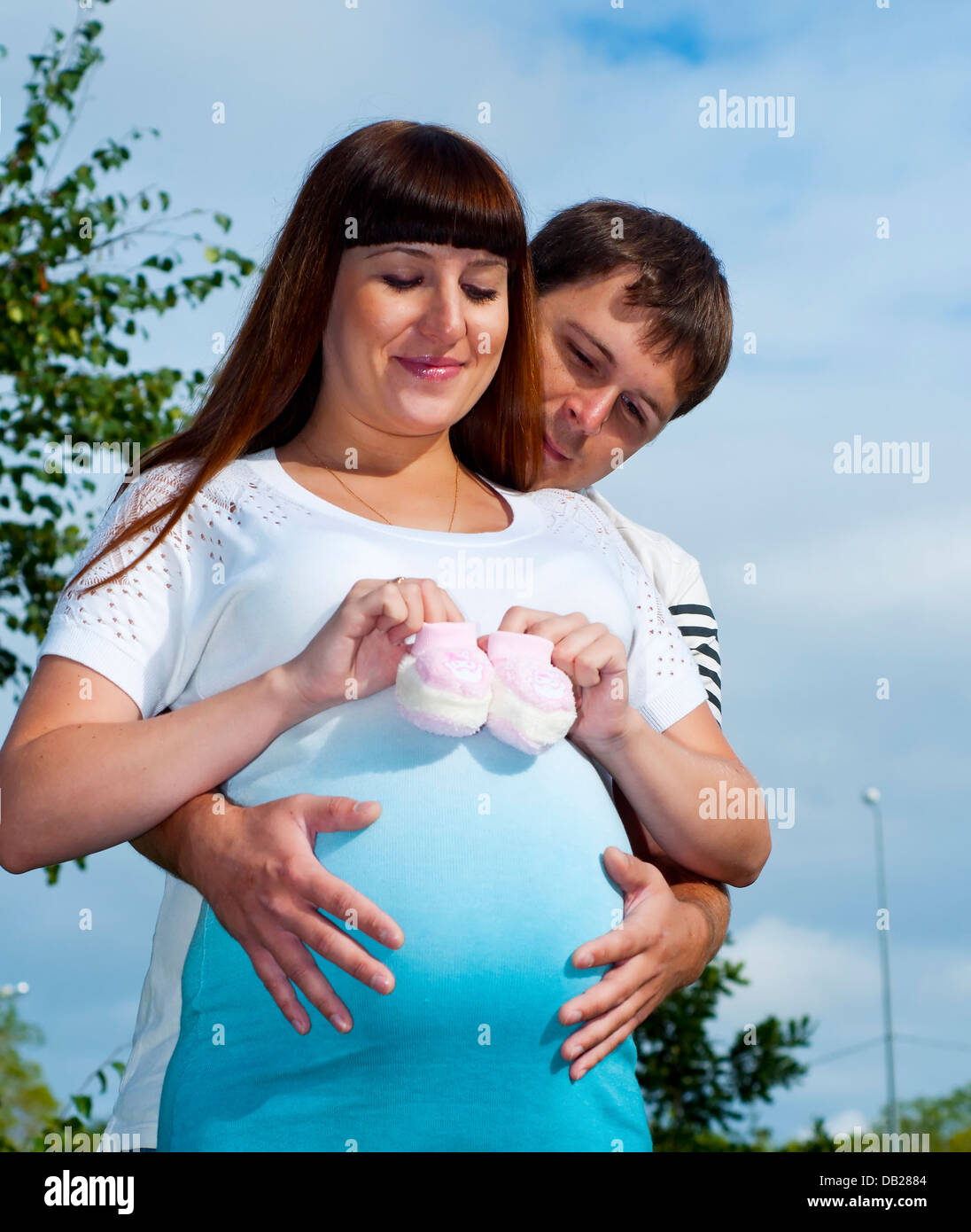 couple lays together, hugging, pregnant woman Stock Photo - Alamy