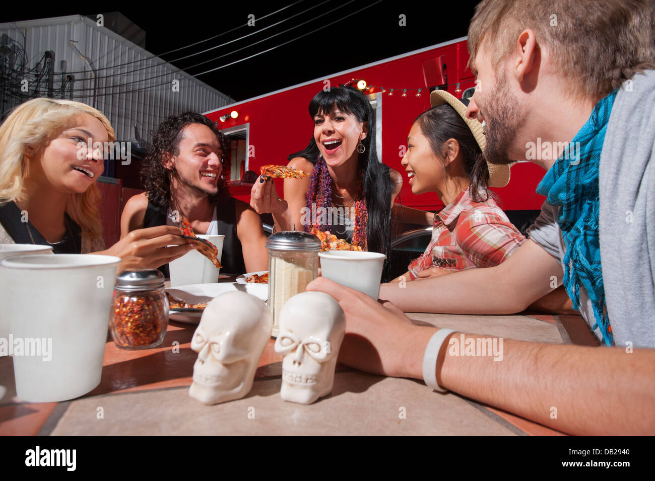 Cheerful Friends Eating Pizza Stock Photo - Alamy