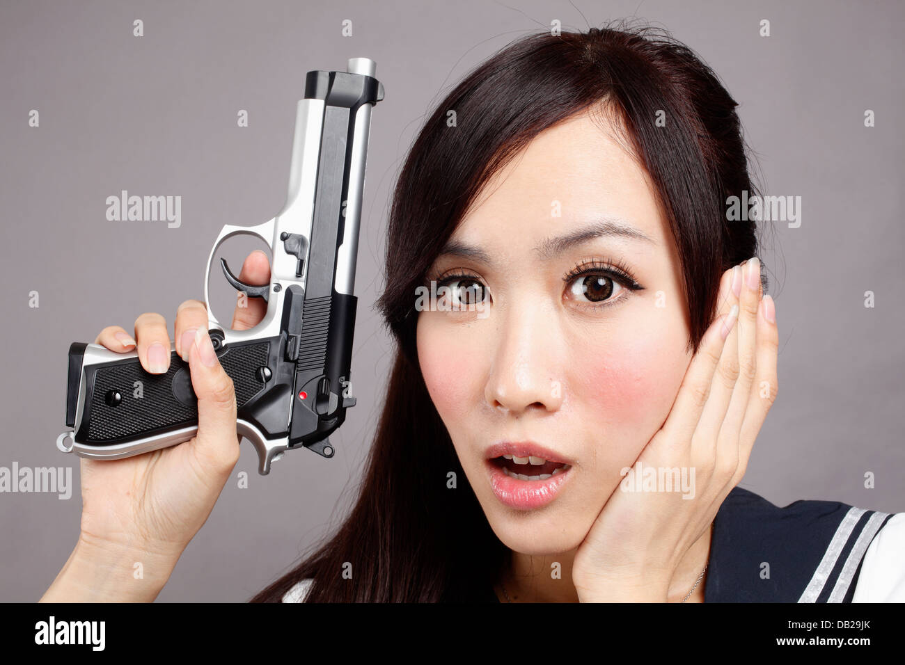 School girl plays gun Stock Photo - Alamy
