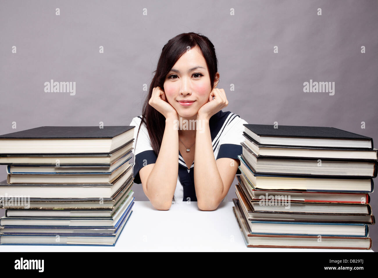 School girl is studying book Stock Photo - Alamy