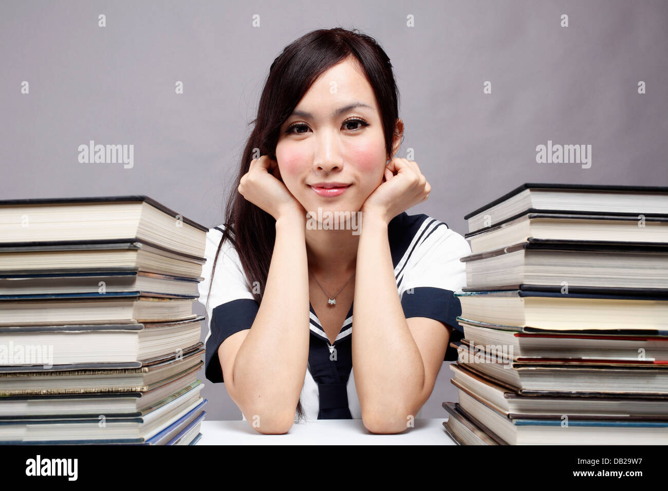 School girl is studying book Stock Photo - Alamy