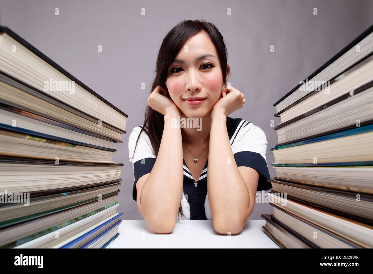 School girl is studying book Stock Photo - Alamy