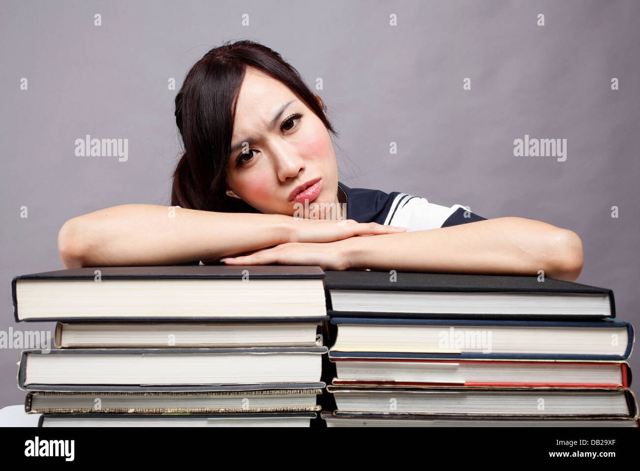 School girl is studying book Stock Photo - Alamy