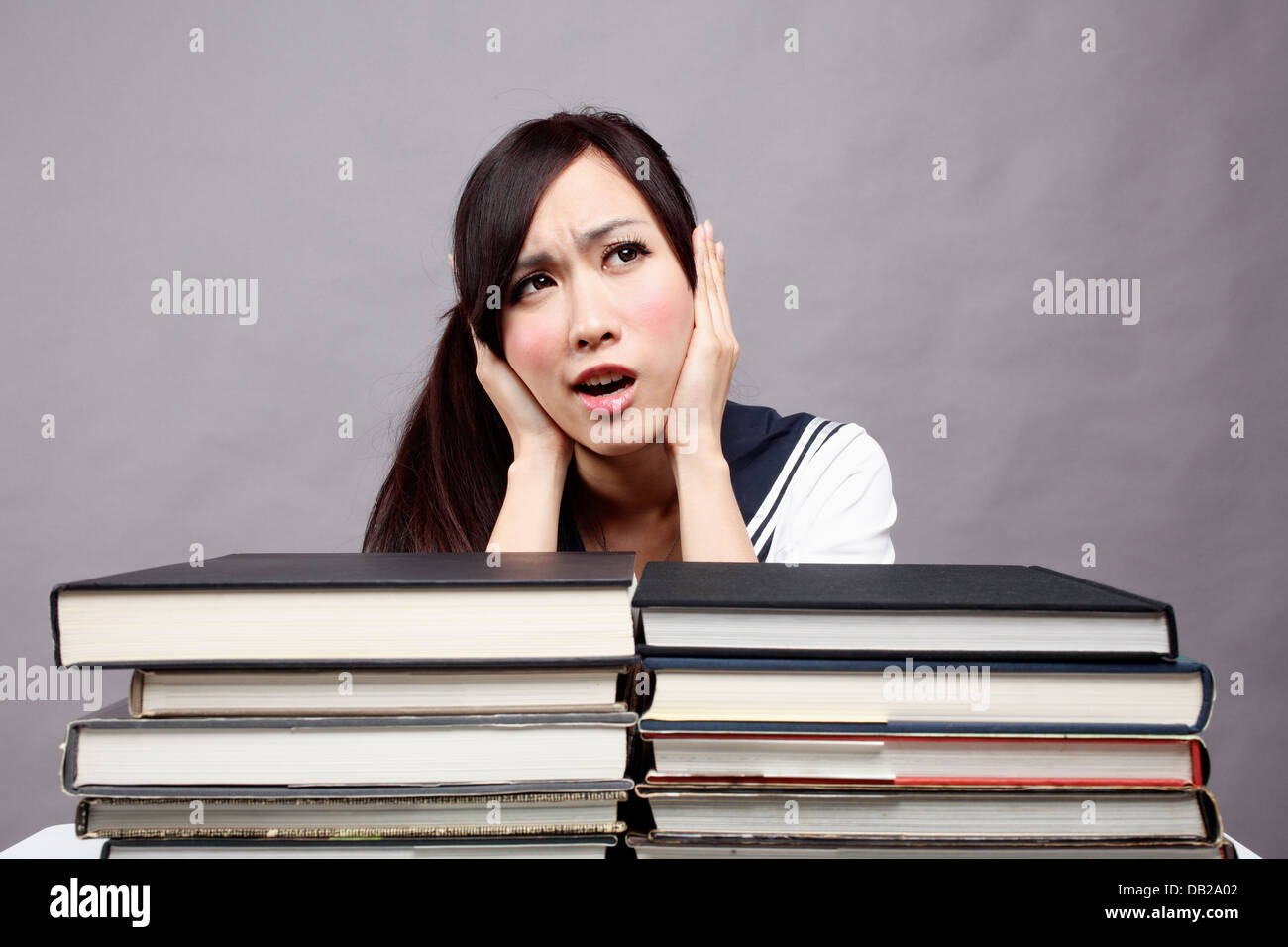 School girl is studying book Stock Photo - Alamy