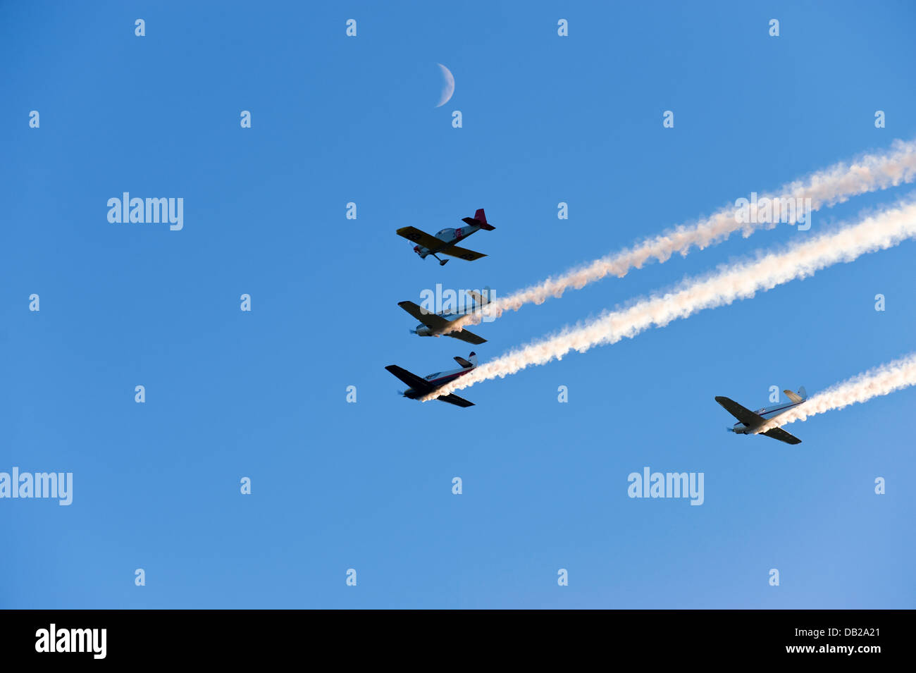 A group of planes fly formation with the crescent moon in the ...