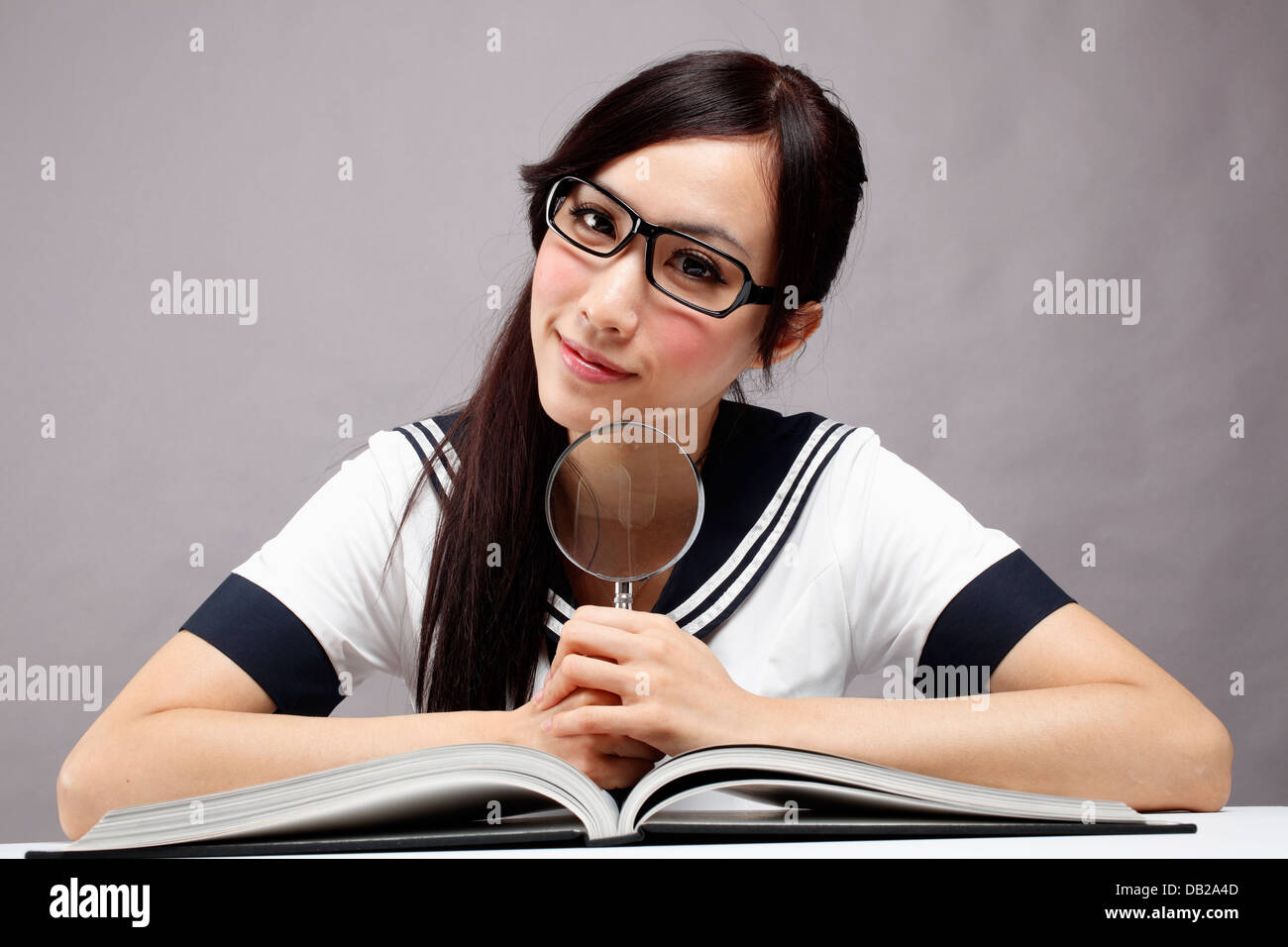 School girl is studying book Stock Photo - Alamy