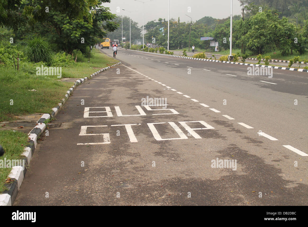Bus Stop sign on the road Stock Photo - Alamy