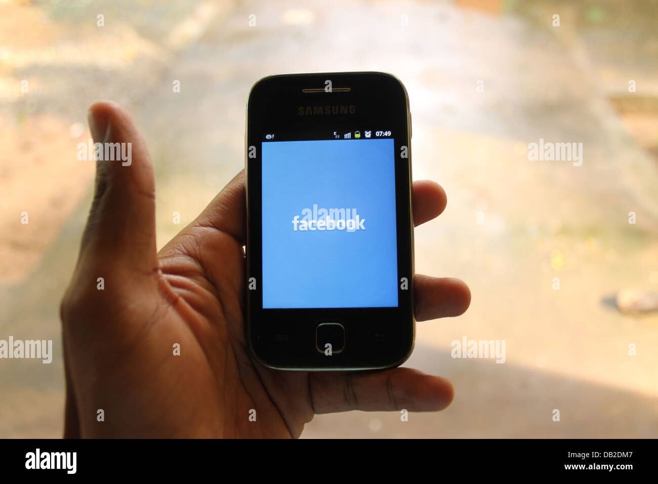 Facebook page on a smartphone Stock Photo - Alamy
