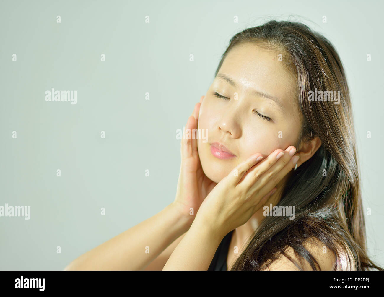 beautiful woman Face and hand touch face with smile Stock Photo - Alamy